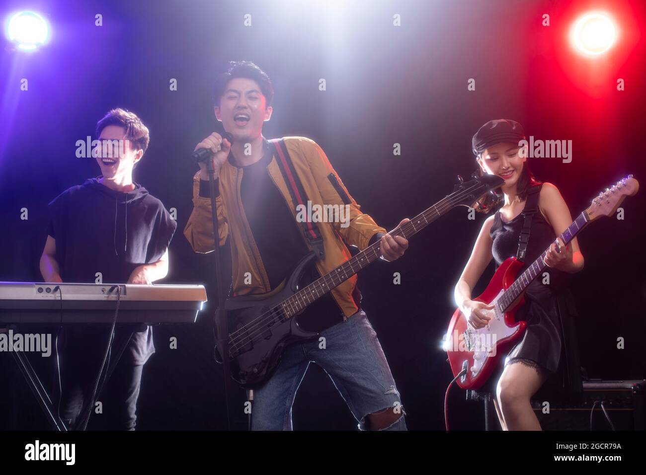 Young musical band on stage Stock Photo - Alamy