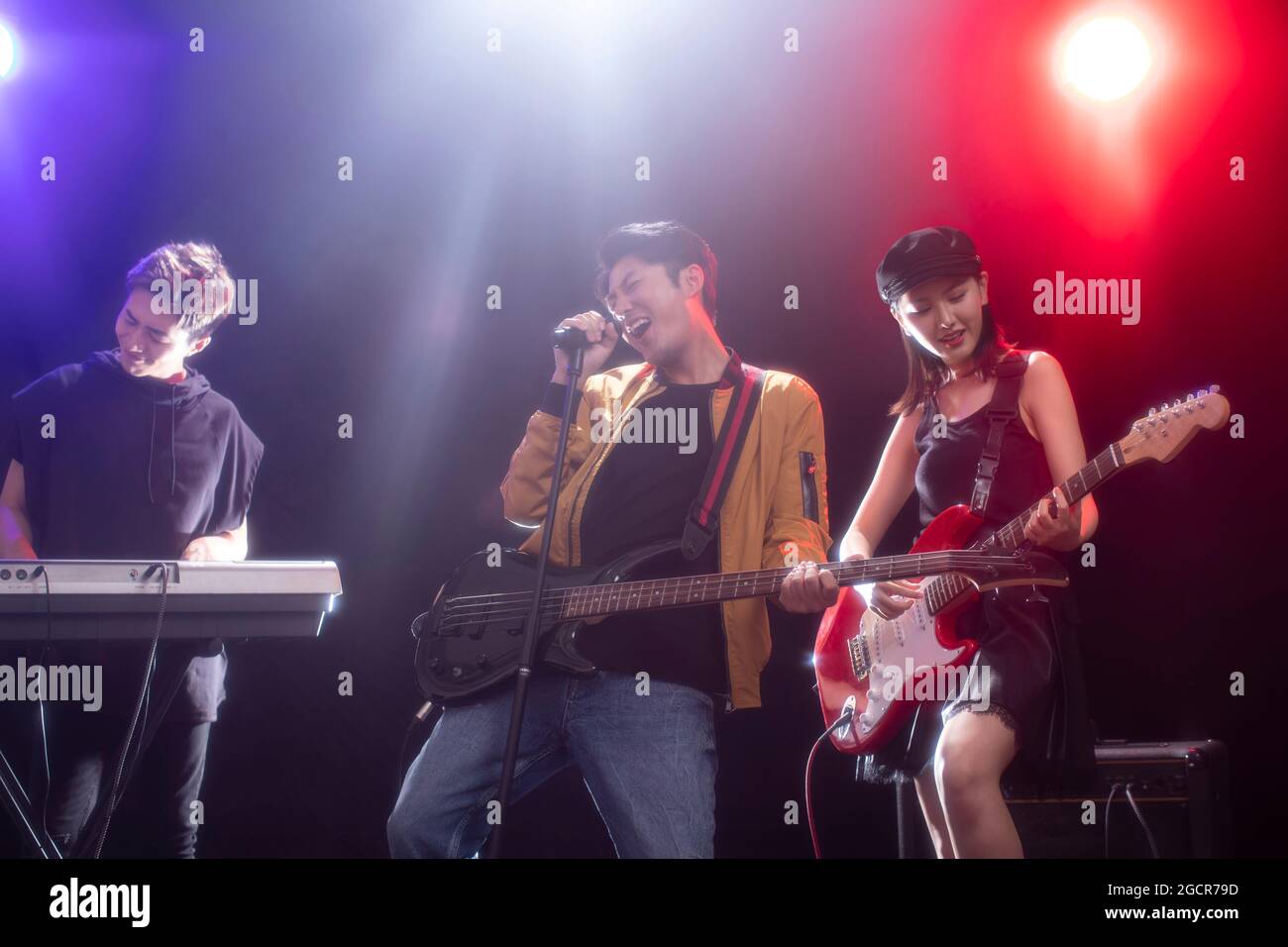 Young musical band on stage Stock Photo - Alamy