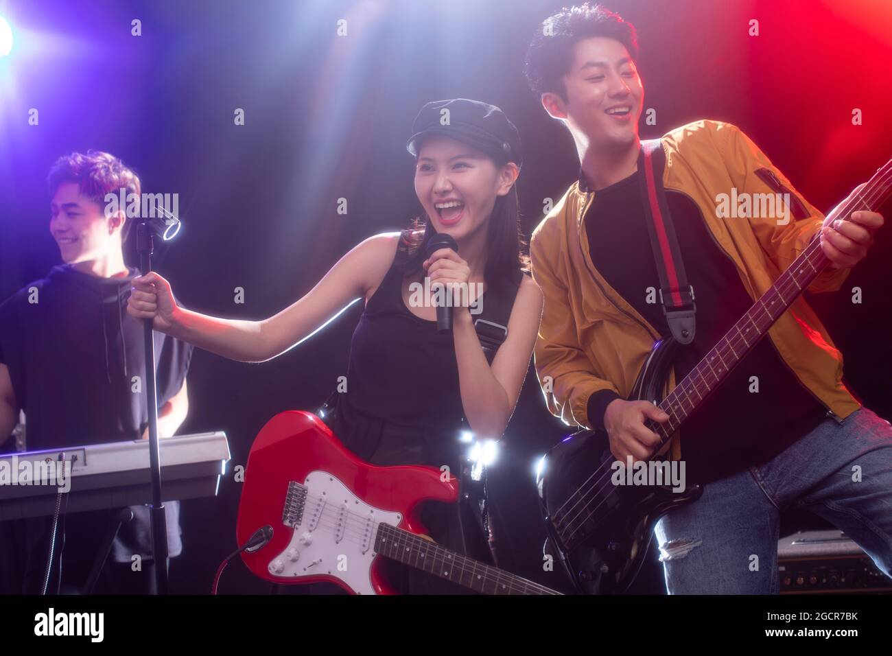 Young musical band on stage Stock Photo - Alamy