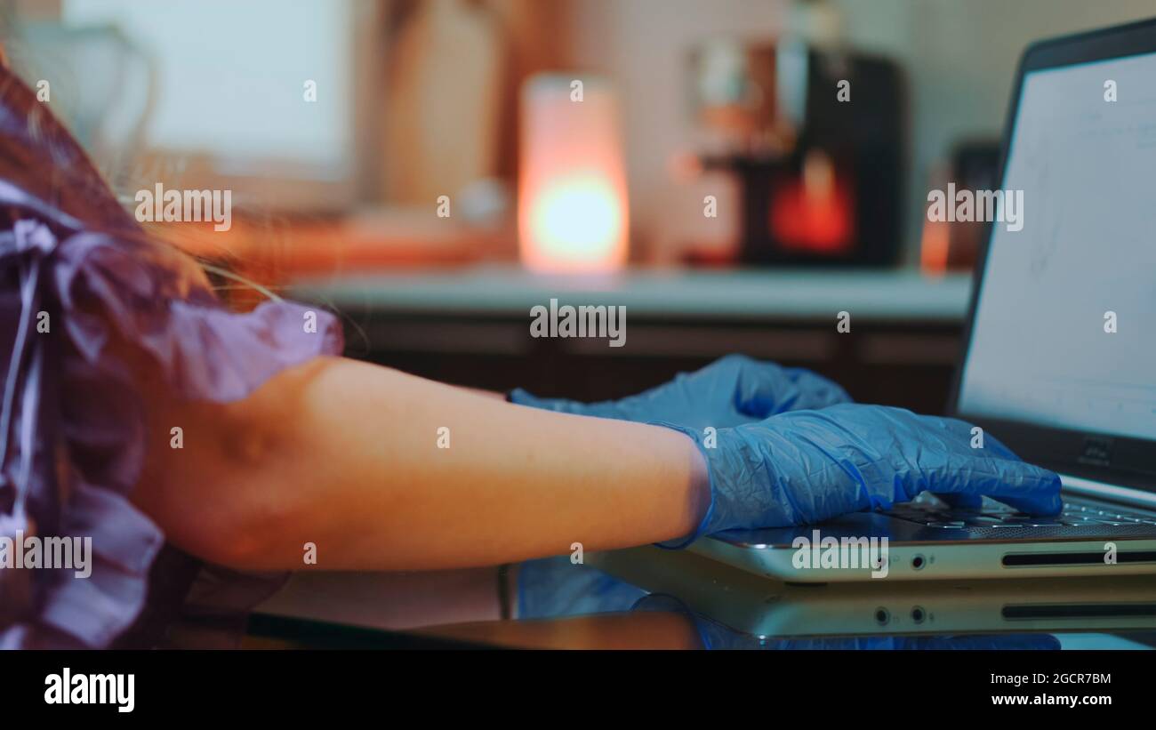 Computer keyboard hands gloves typing hi-res stock photography and ...