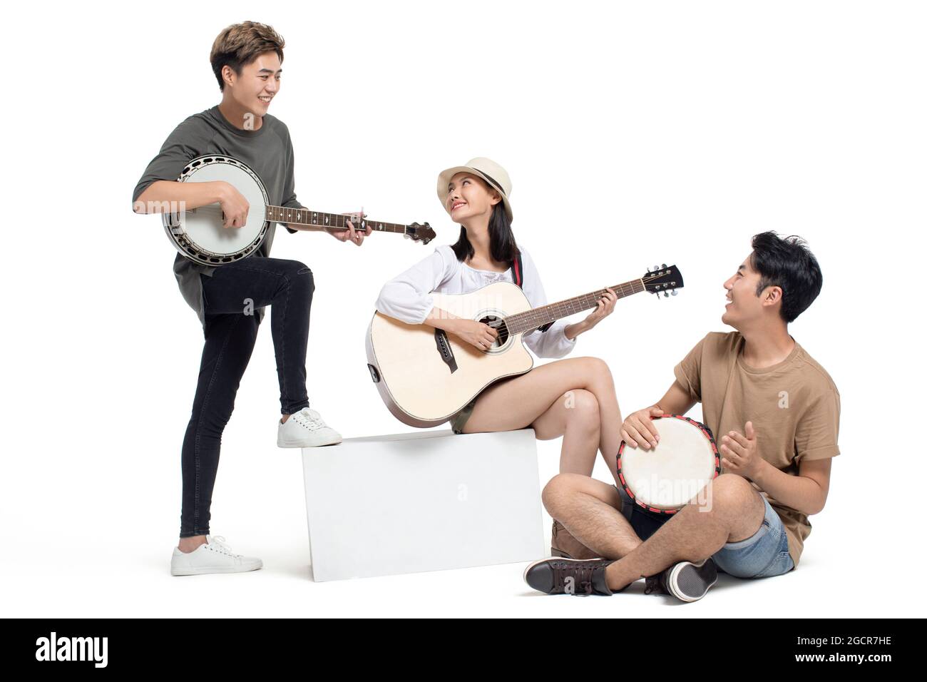 Young people playing musical instrument Stock Photo - Alamy