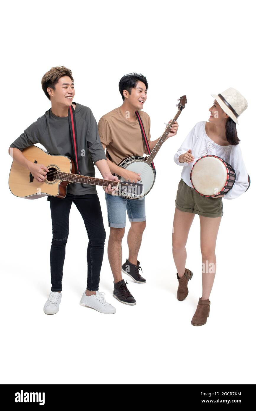 Young people playing musical instrument Stock Photo - Alamy