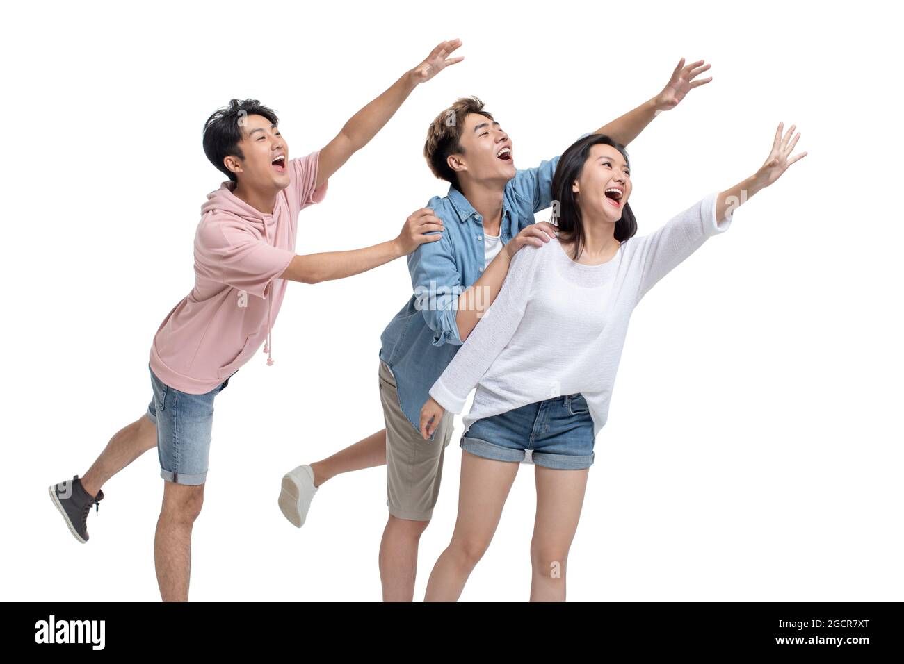Happy young friends reaching out hands Stock Photo - Alamy