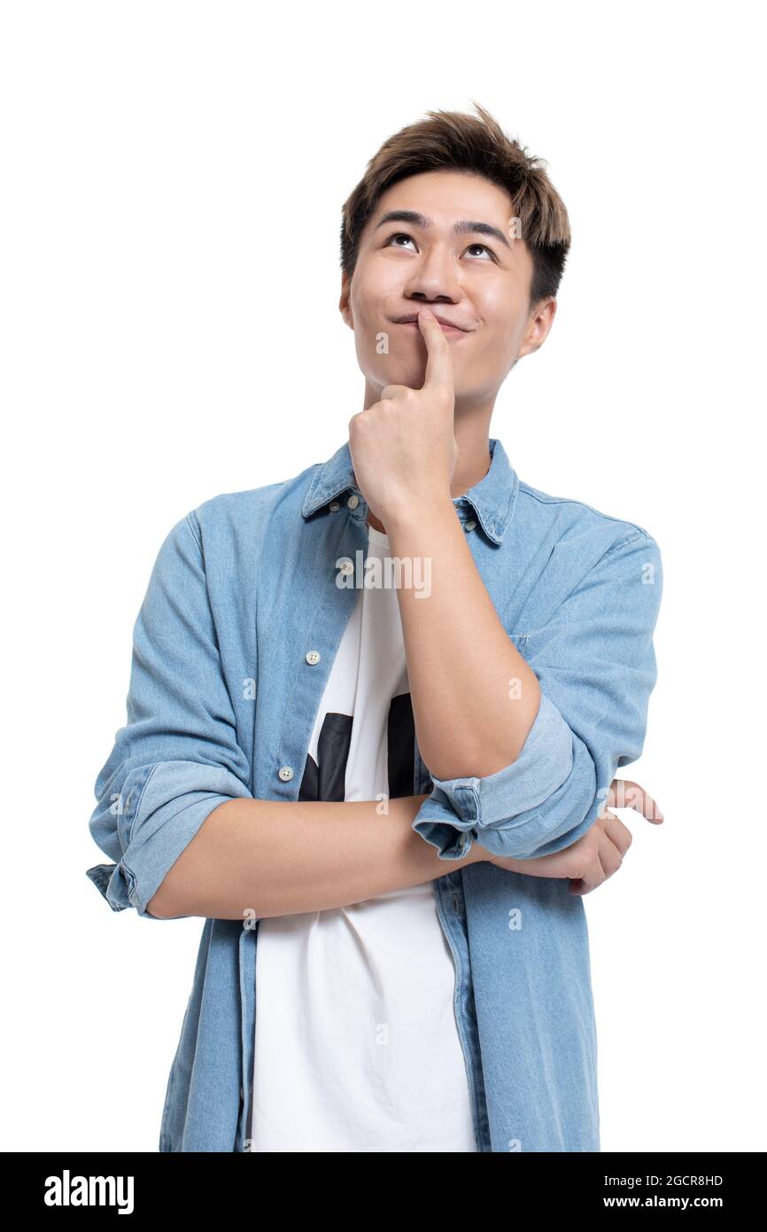 Young man thinking Stock Photo - Alamy