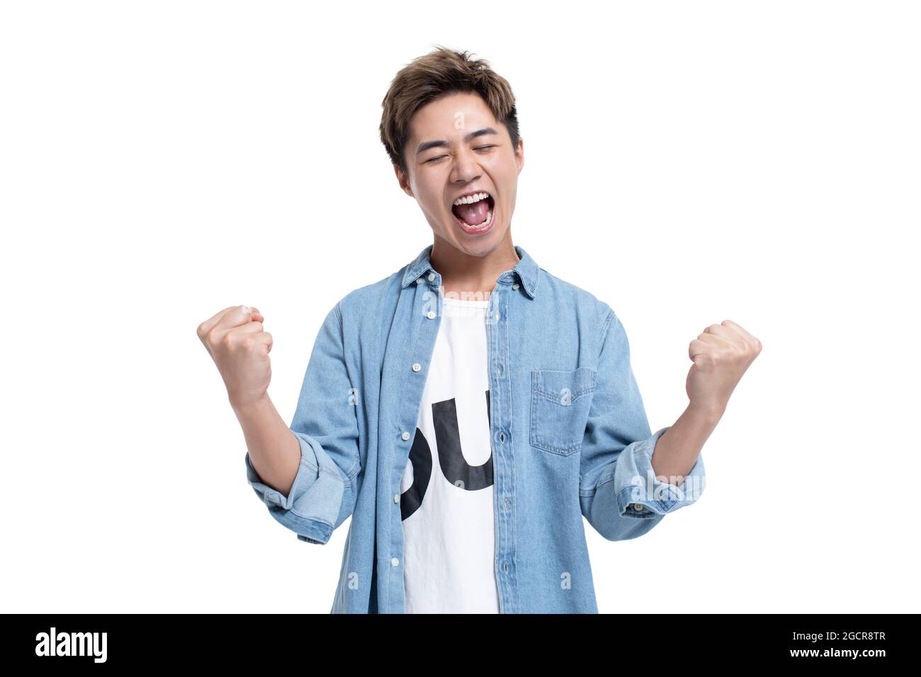 Happy young man punching the air Stock Photo - Alamy