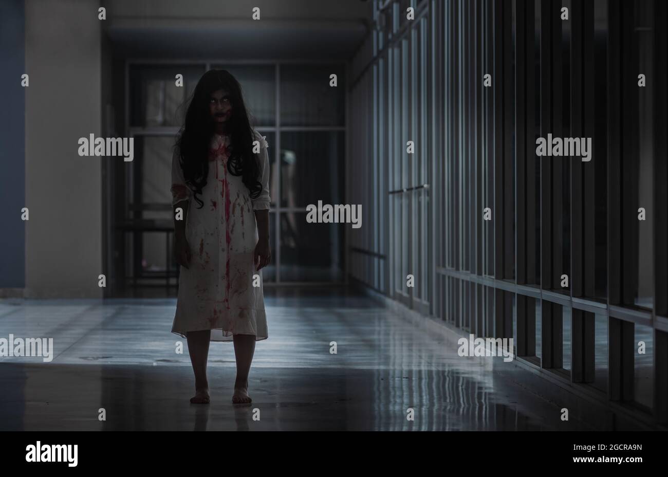 Horror evil woman ghost creepy in a dark room at house. The female ...