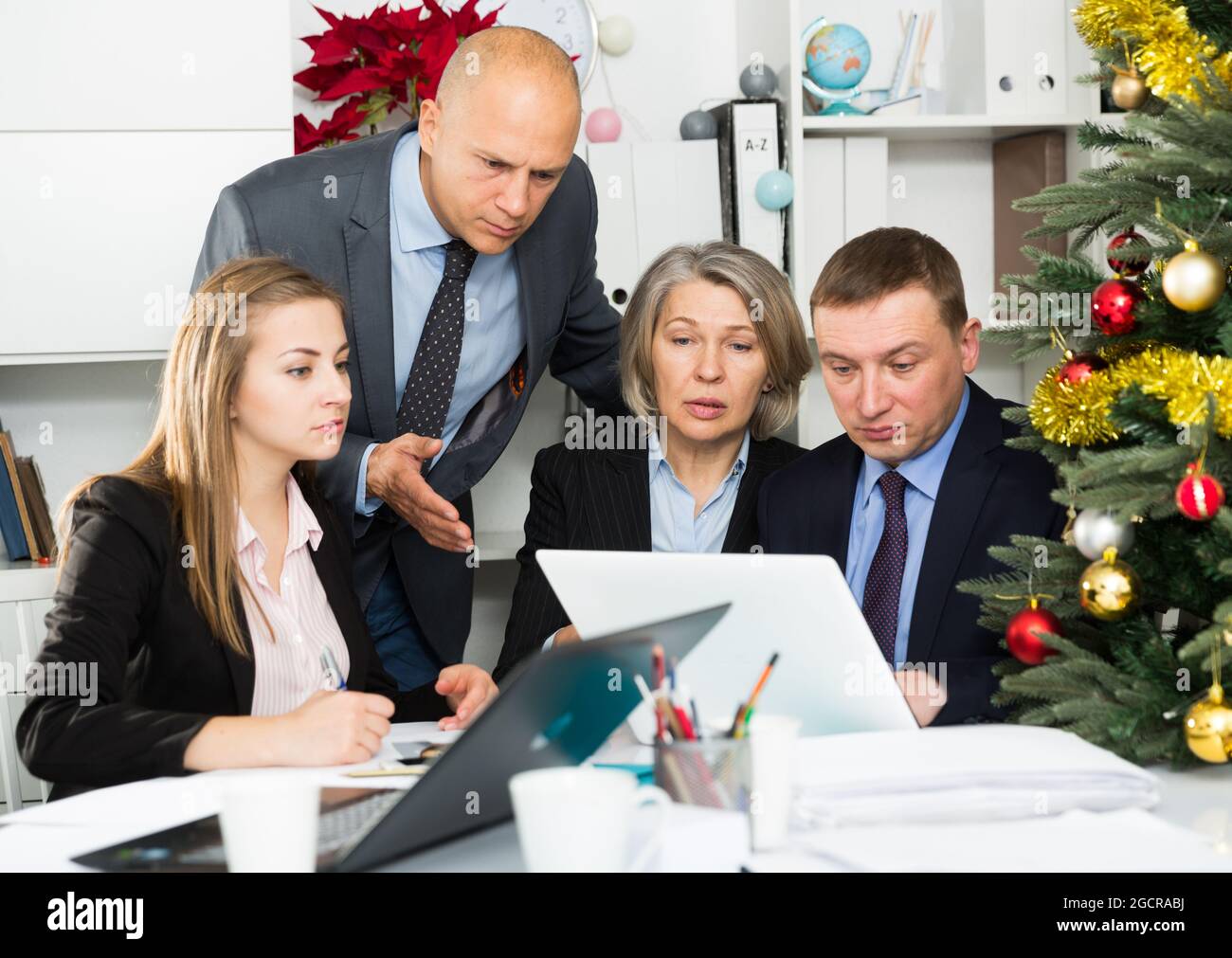 Boss controlling teamwork Stock Photo - Alamy