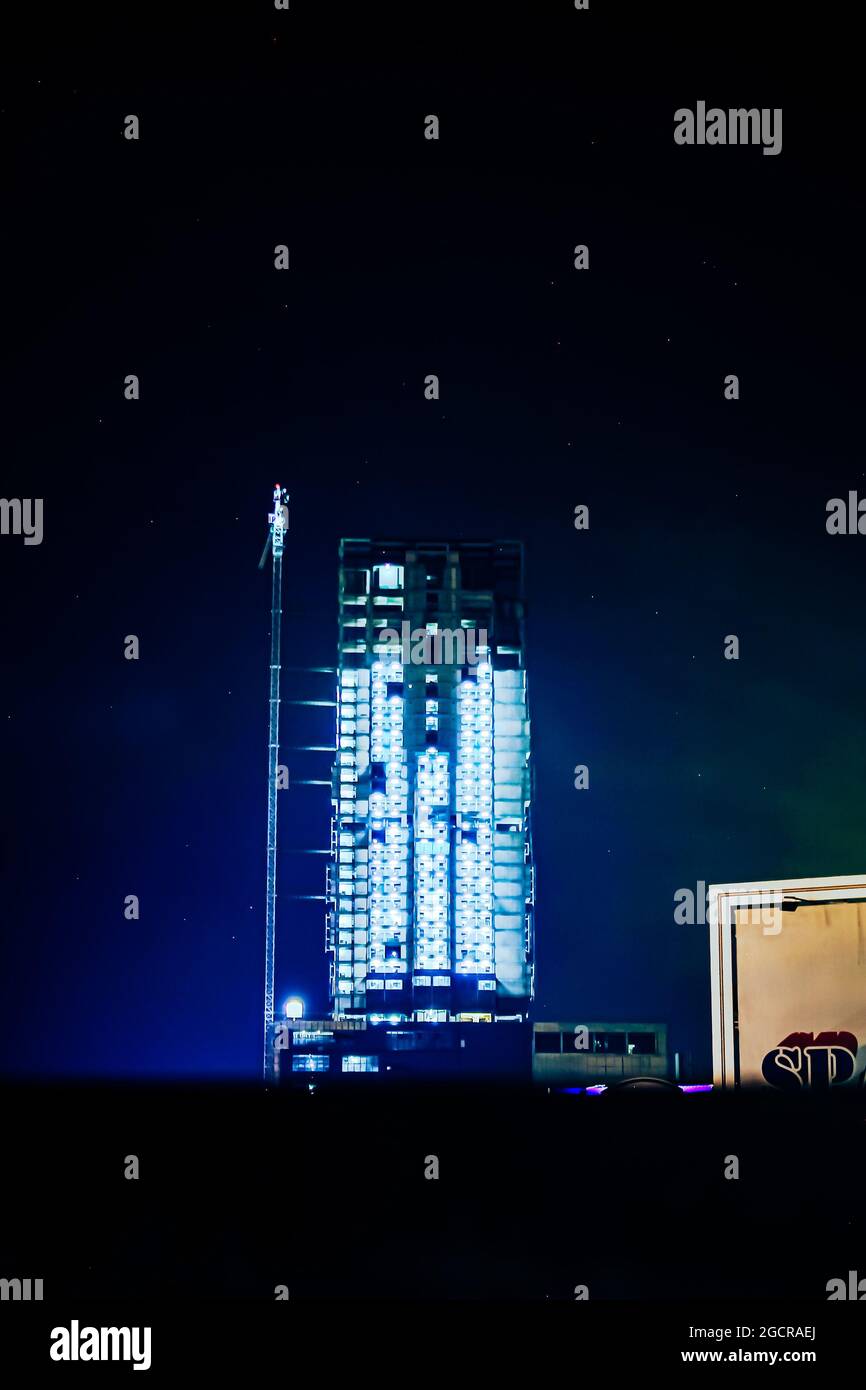 Tall building with lights at night Stock Photo - Alamy