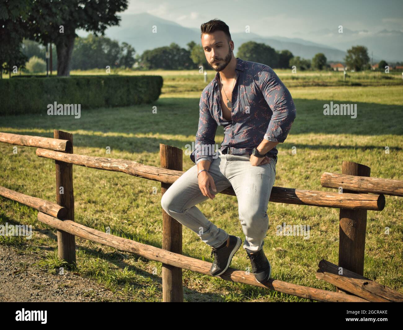 Man sitting fence hi-res stock photography and images - Alamy