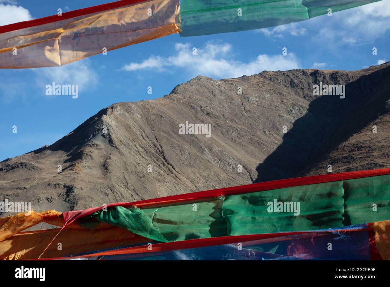 Prayer flags in front of the mountains of the Himalaya. The amazing ...