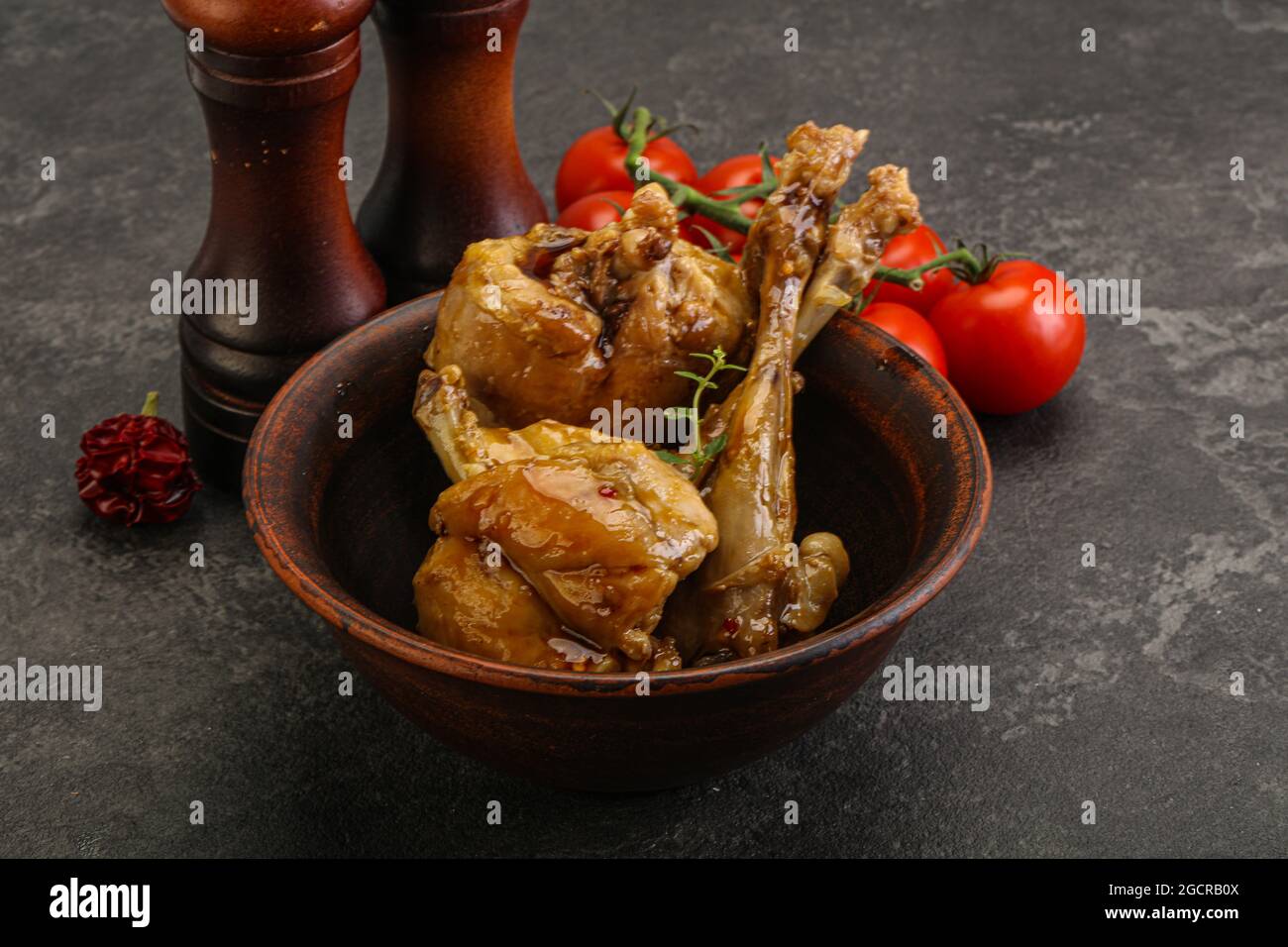 Rabbit stew in sweet and spicy sauce Stock Photo - Alamy