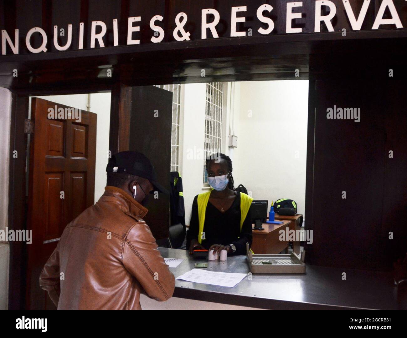 Kampala, Uganda. 9th Aug, 2021. A passenger buys a train ticket in ...