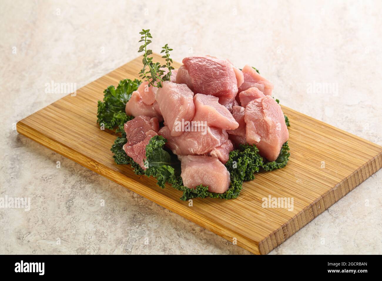Raw pork meat cubes for coocking over board Stock Photo - Alamy