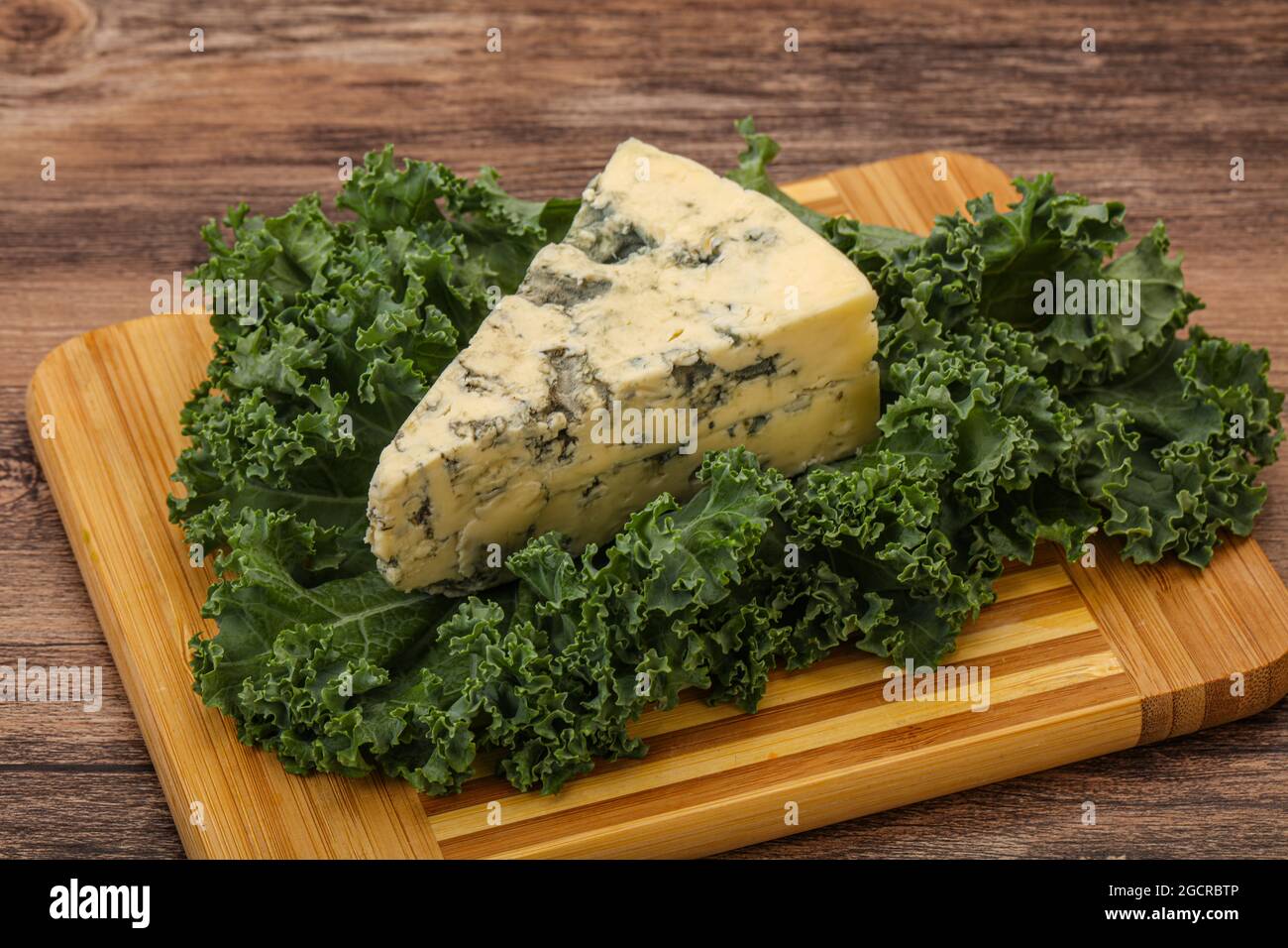 Dairy Blue cheese triangle with mold Stock Photo - Alamy