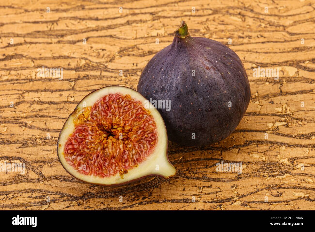 Sweet purple slice of fig fruit Stock Photo - Alamy