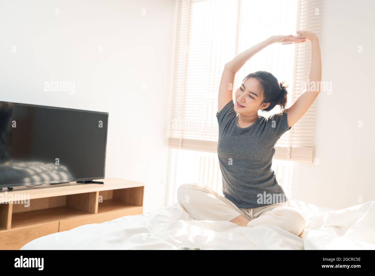 Bedroom concept in the morning the pretty girl just waking up and ...