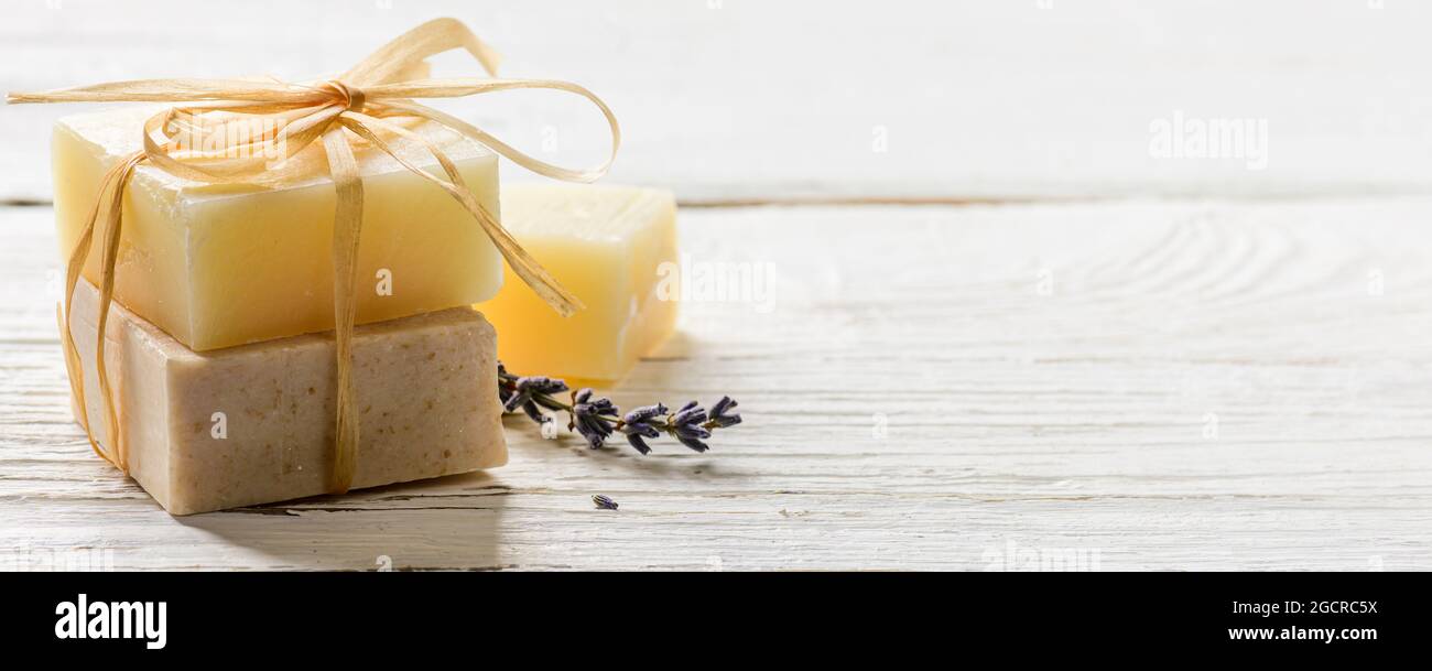 Handmade soaps on white wood table background Stock Photo - Alamy
