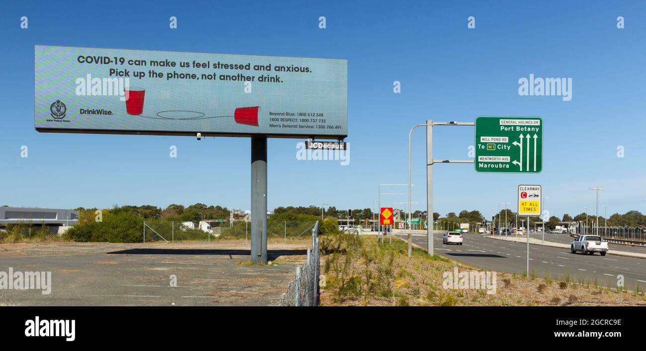 A roadside billboard with a COVID-19 alcohol health warning on General ...