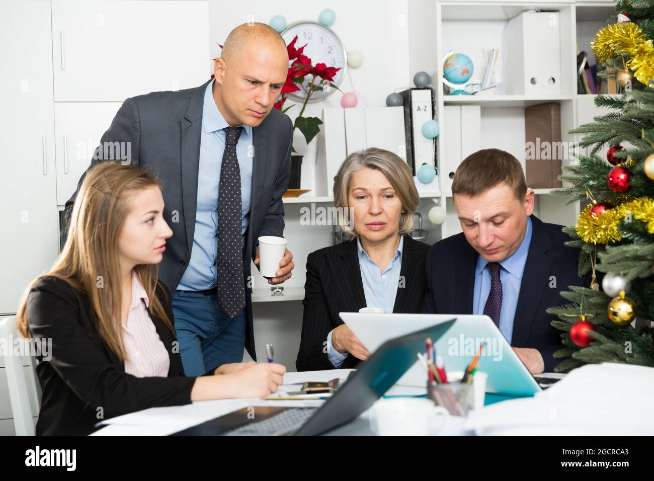 Boss controlling teamwork Stock Photo - Alamy