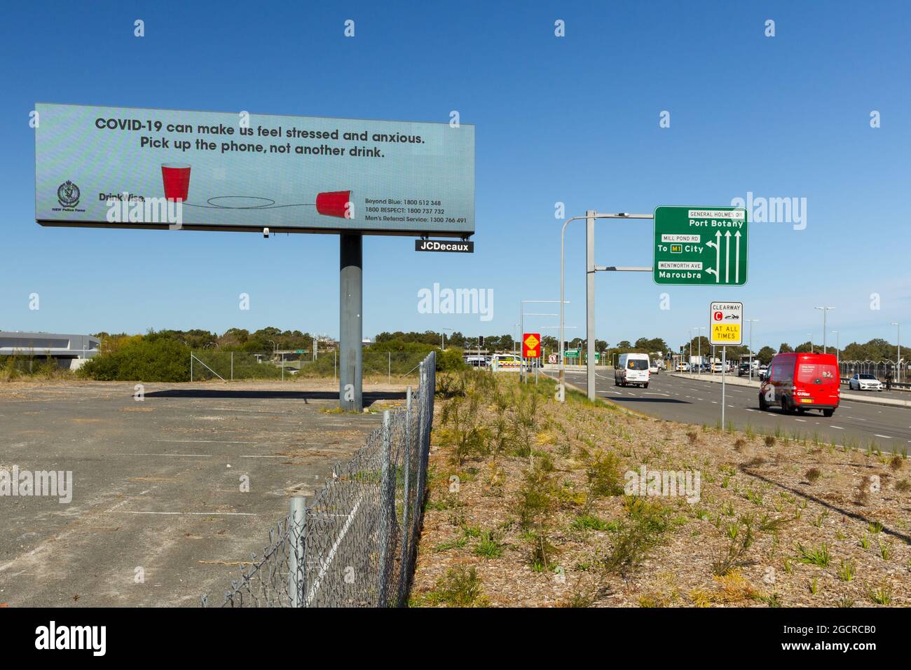 A roadside billboard with a COVID-19 alcohol health warning on General ...