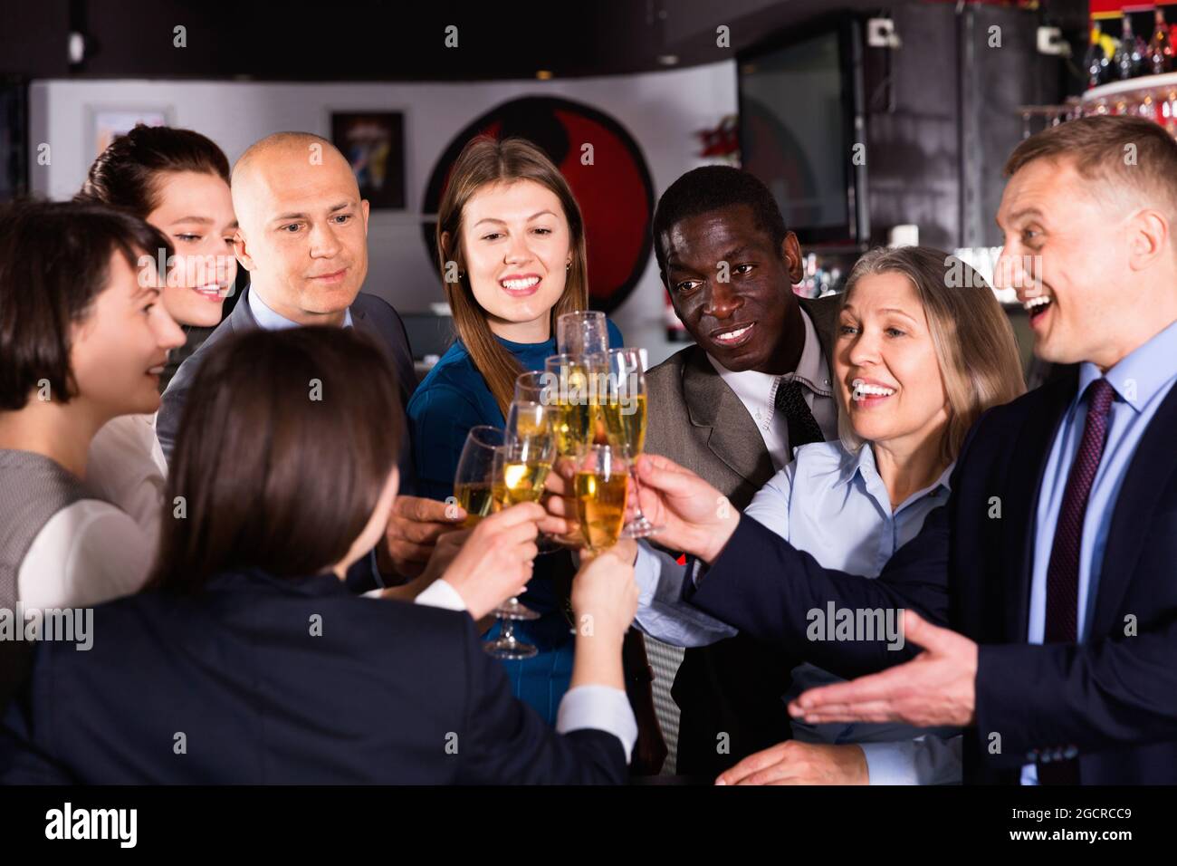 International group of businesspeople toasting with champagne, having ...