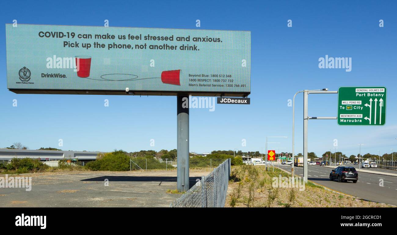 A roadside billboard with a COVID-19 alcohol health warning on General ...