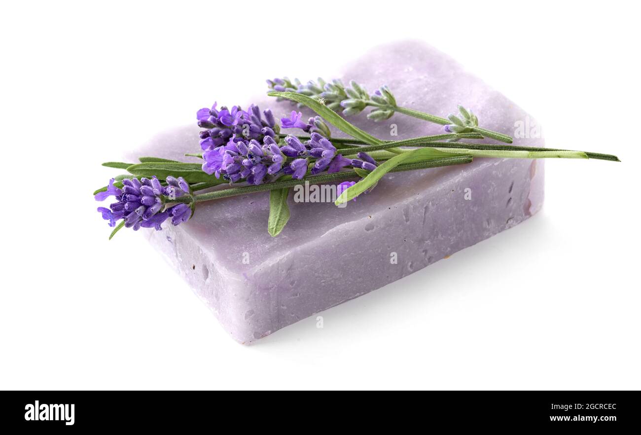 Homemade lavender soap bar with lavender flowers atop isolated on white Stock Photo - Alamy