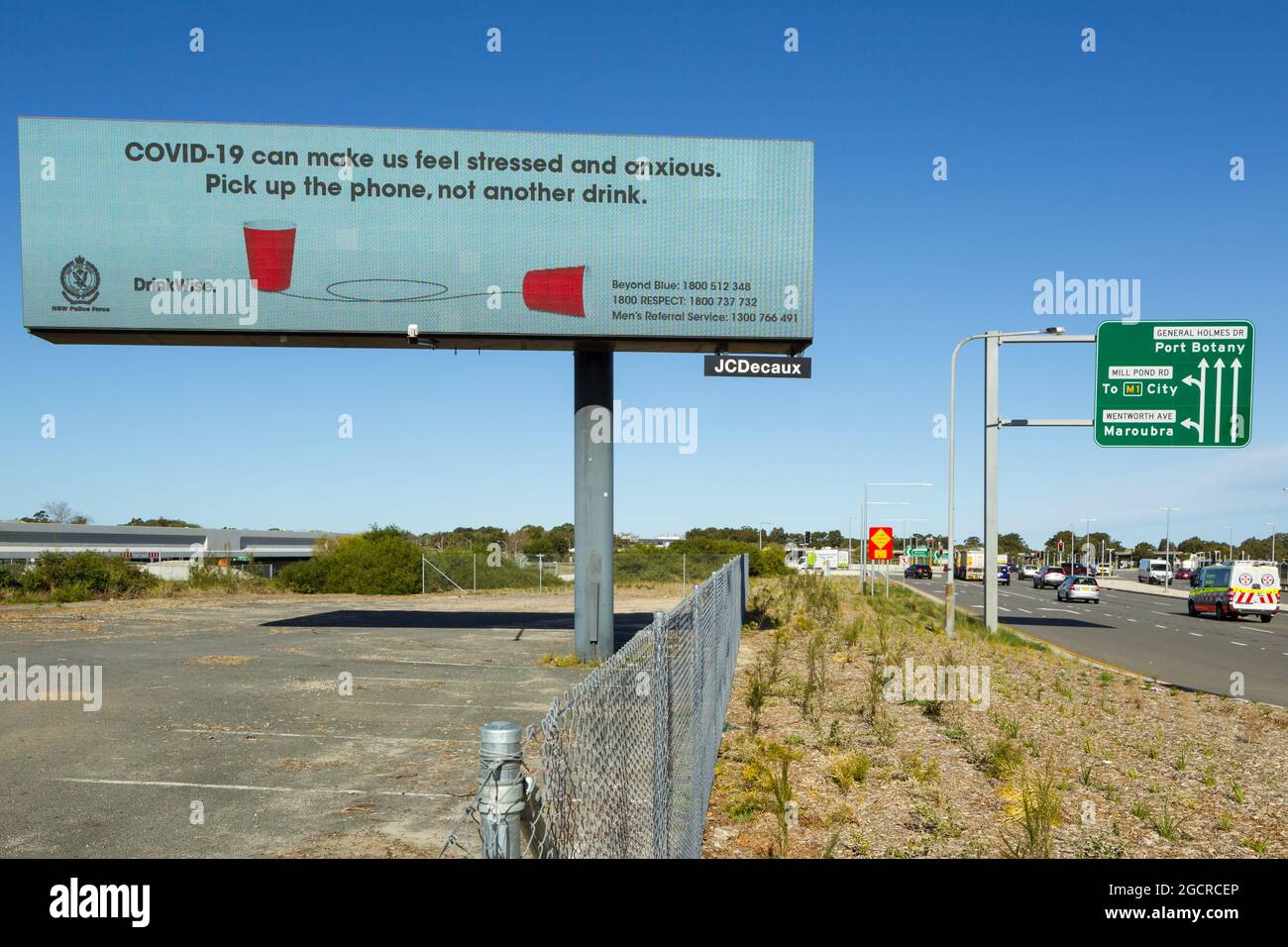 A roadside billboard with a COVID-19 alcohol health warning on General ...
