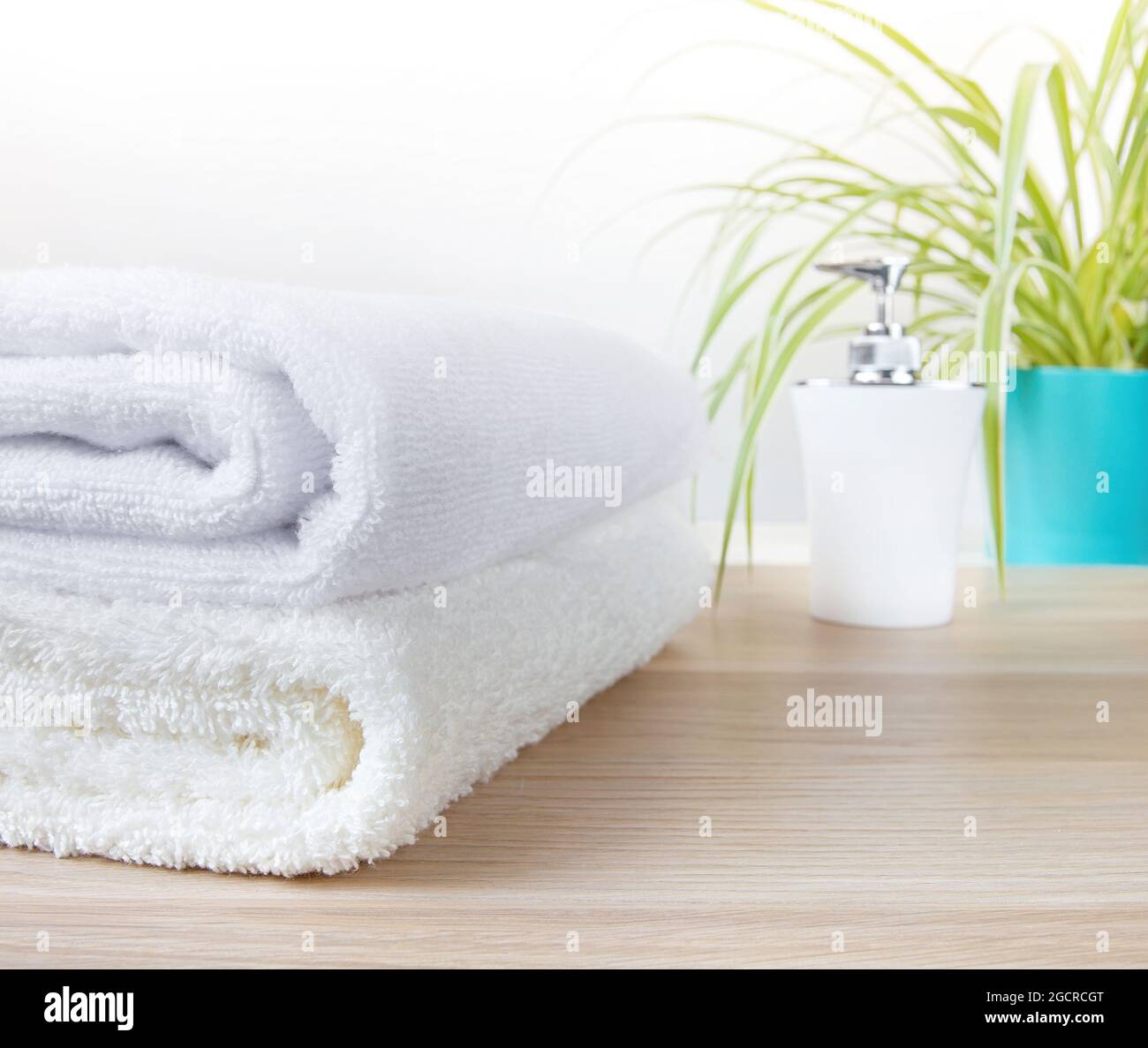 Clean Towels on wood top table in bathroom Stock Photo - Alamy