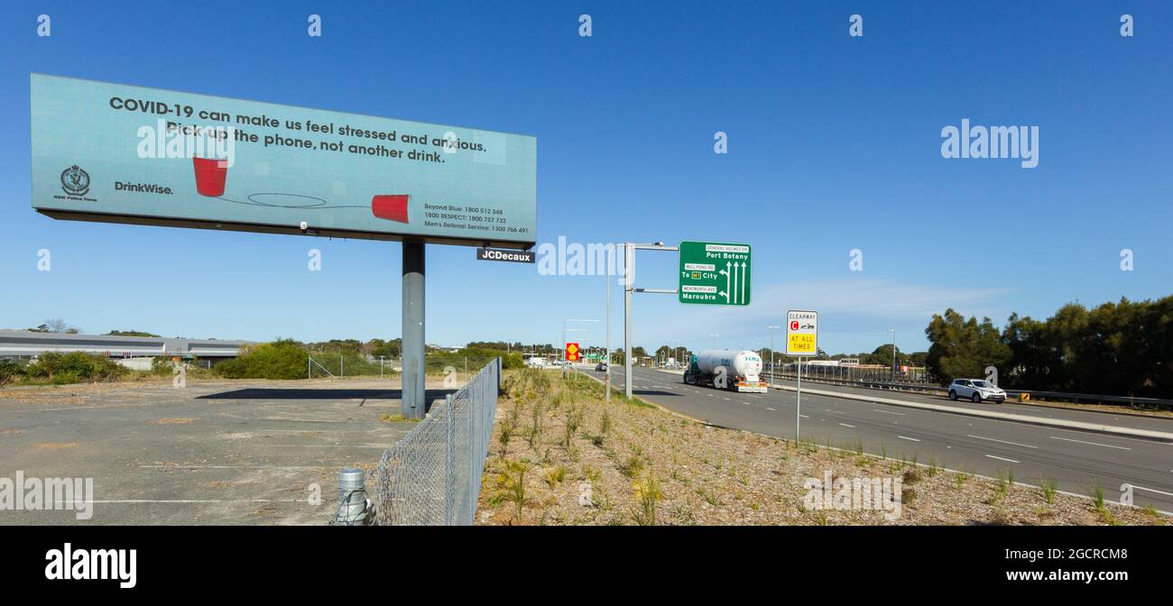 A roadside billboard with a COVID-19 alcohol health warning on General ...