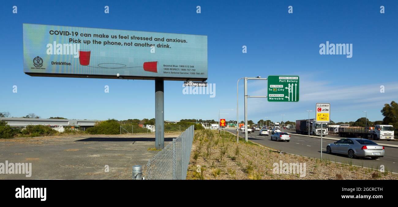 A roadside billboard with a COVID-19 alcohol health warning on General ...