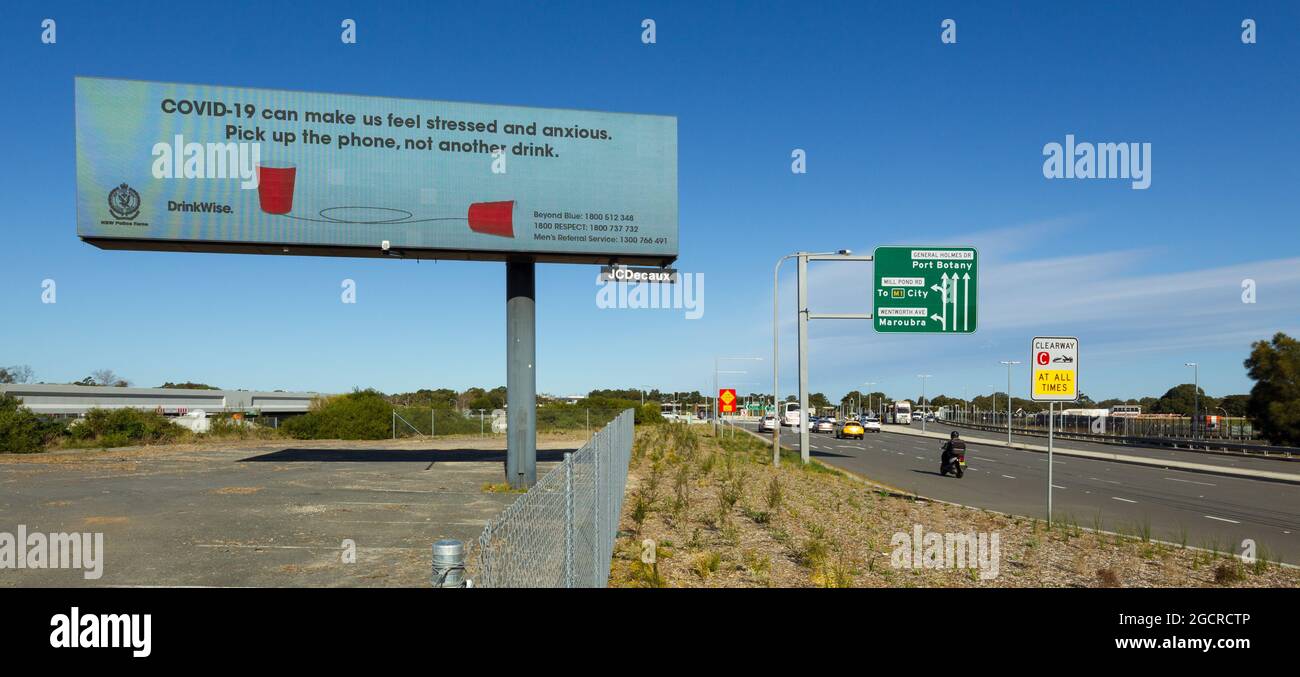 A roadside billboard with a COVID-19 alcohol health warning on General ...