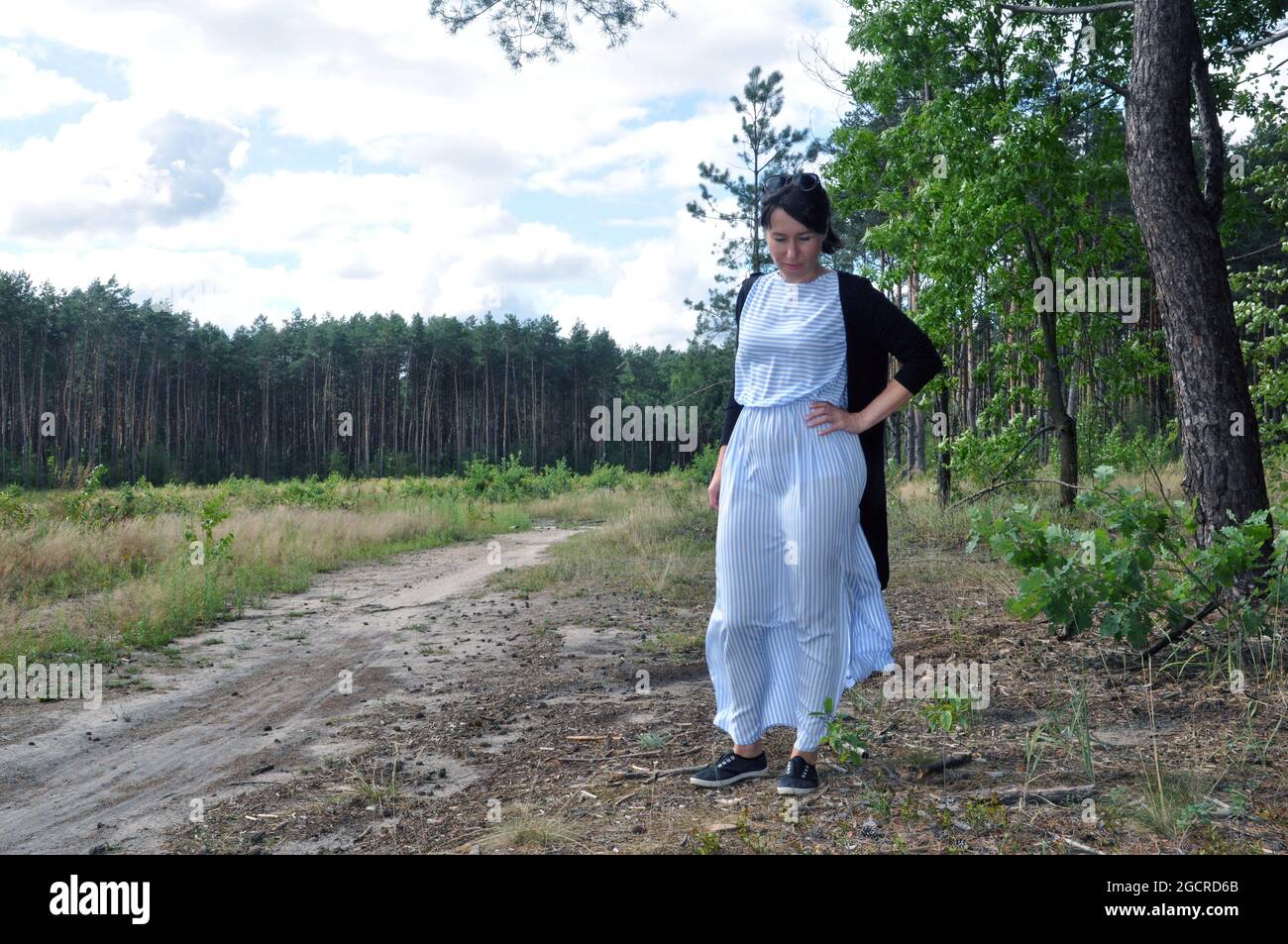 Beautiful young woman on a walk in the summer forest. Nature Stock ...