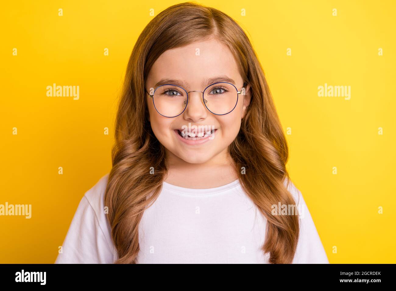Photo of young little girl happy positive toothy smile wear glasses ...