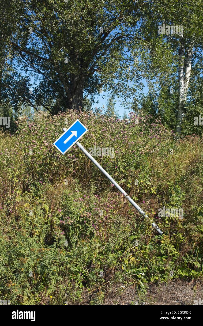 tilted blue and white arrow sign Stock Photo - Alamy