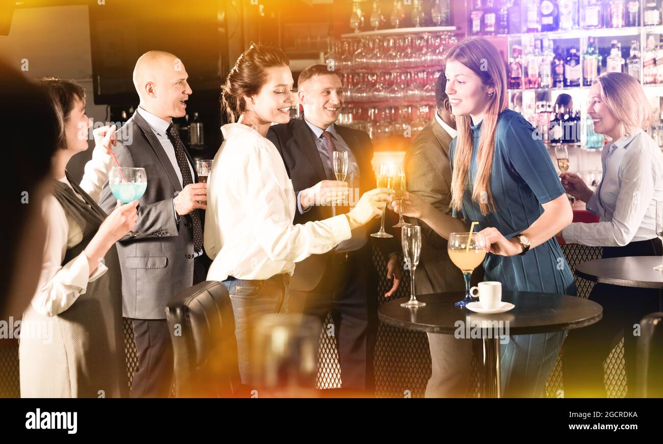 Young attractive women with cocktails having fun with workmates Stock ...