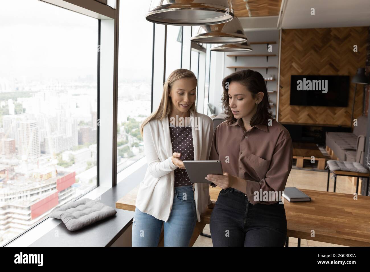 Company mentor training new hired employee, intern, explaining using ...