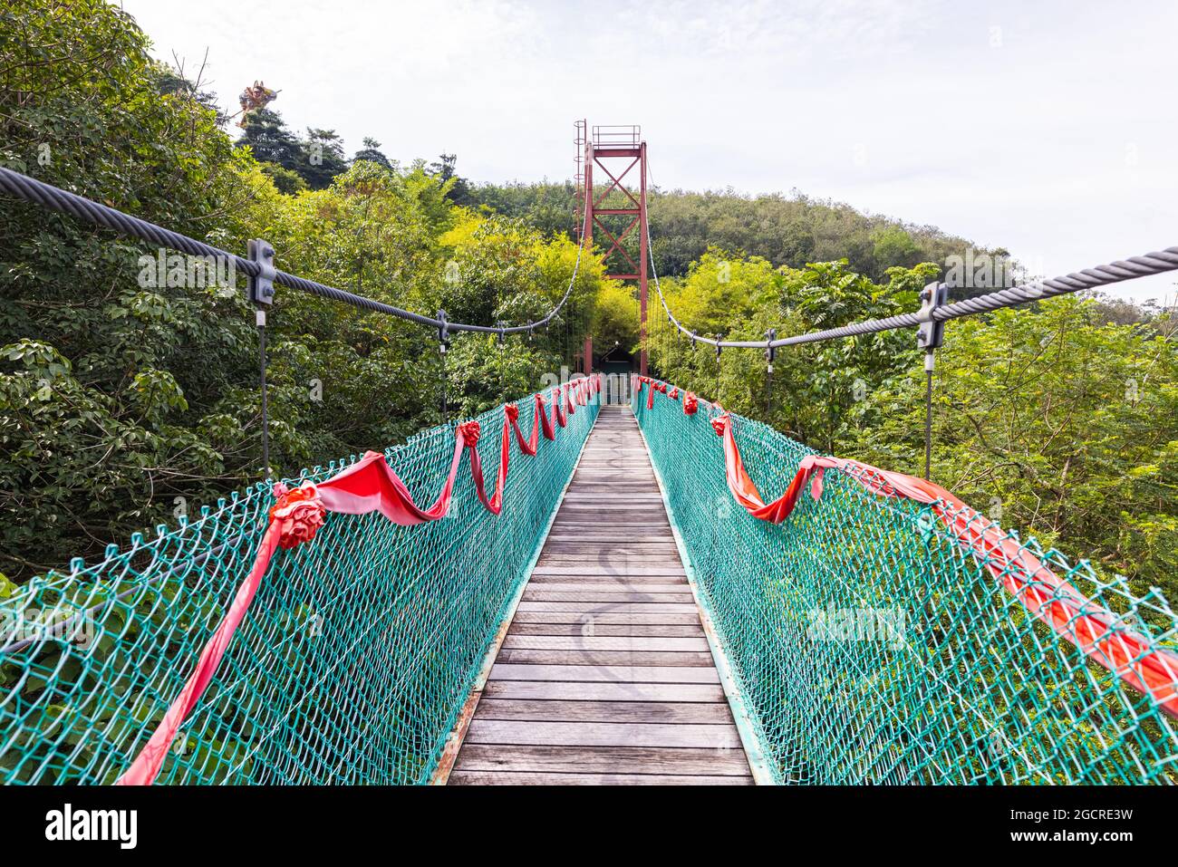 Suspension bridge over a small valley near the Sak Dato Temple and ...