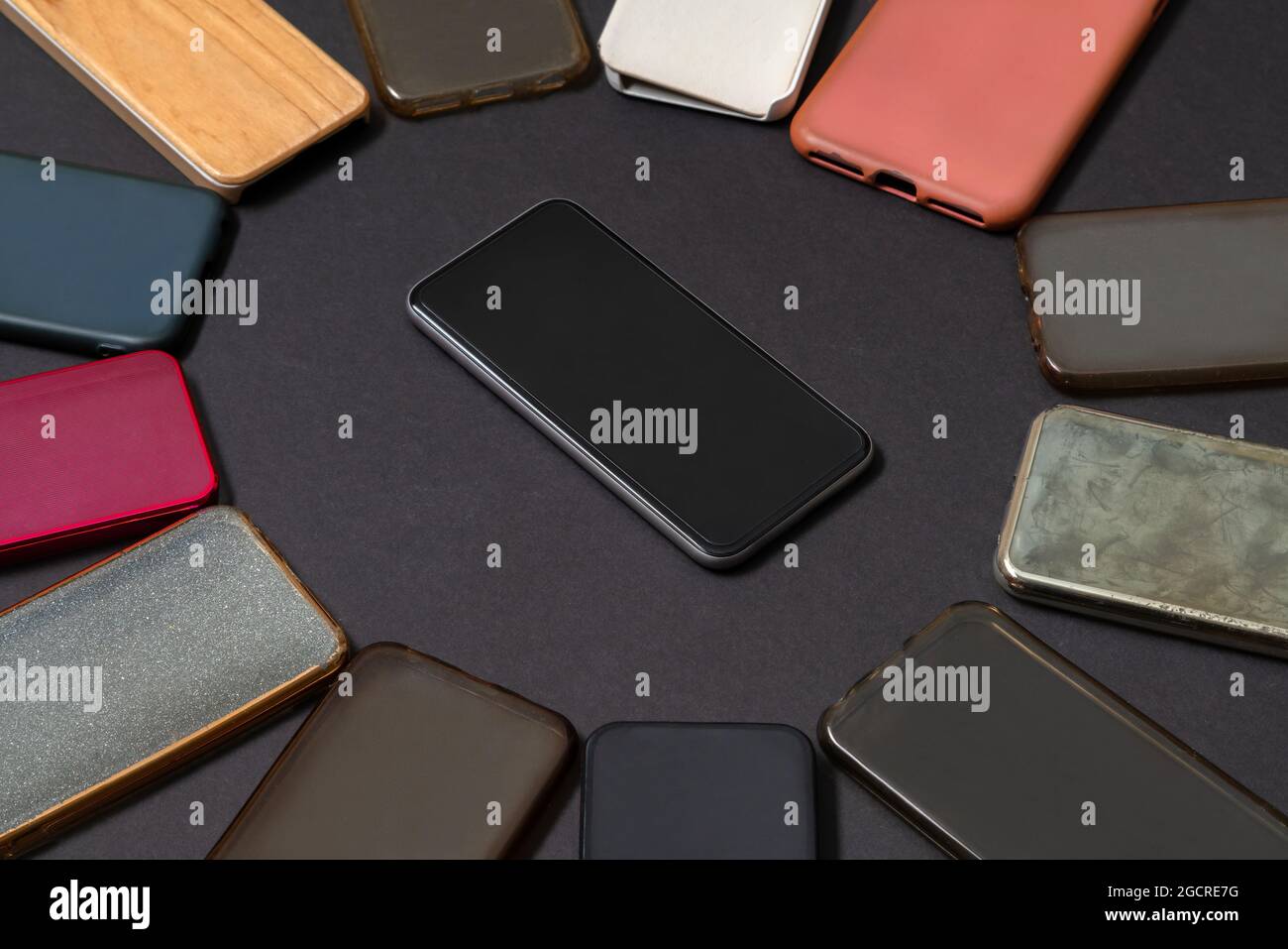 Pile of multicolored plastic back covers for mobile phones on black ...