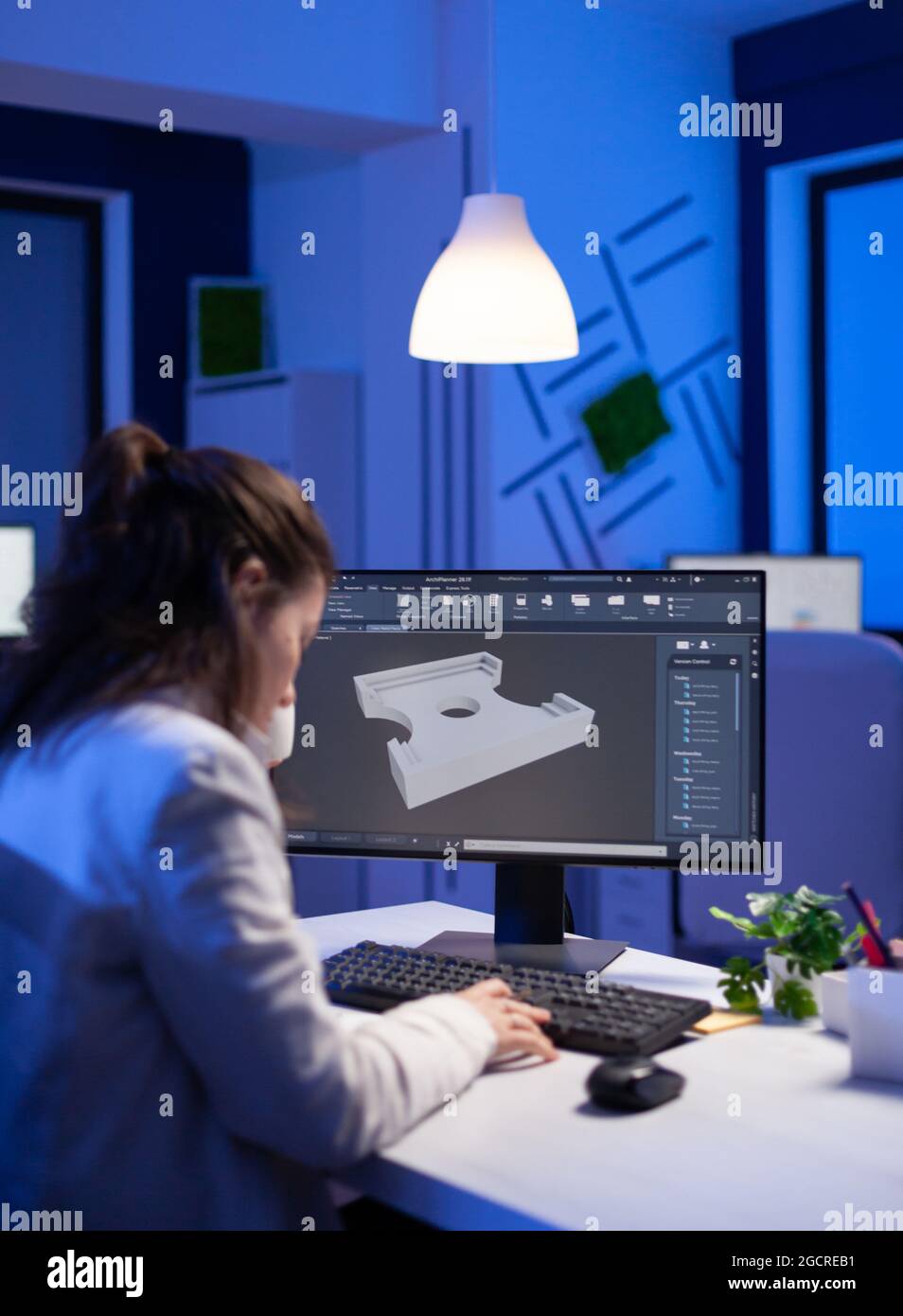 Software engineer working at digital cad project late at night in ...