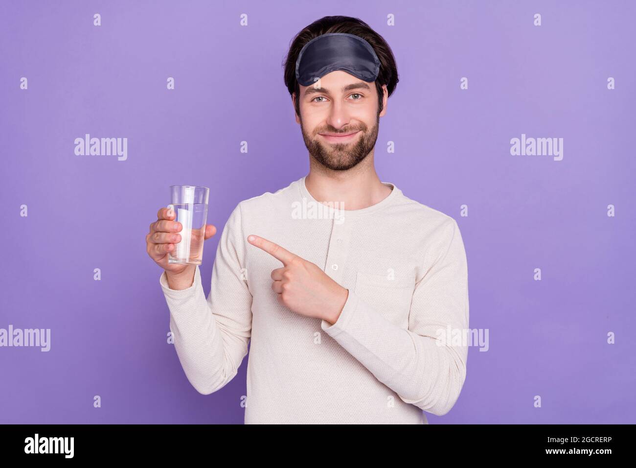 Photo of positive person indicate finger hand hold water cup look ...