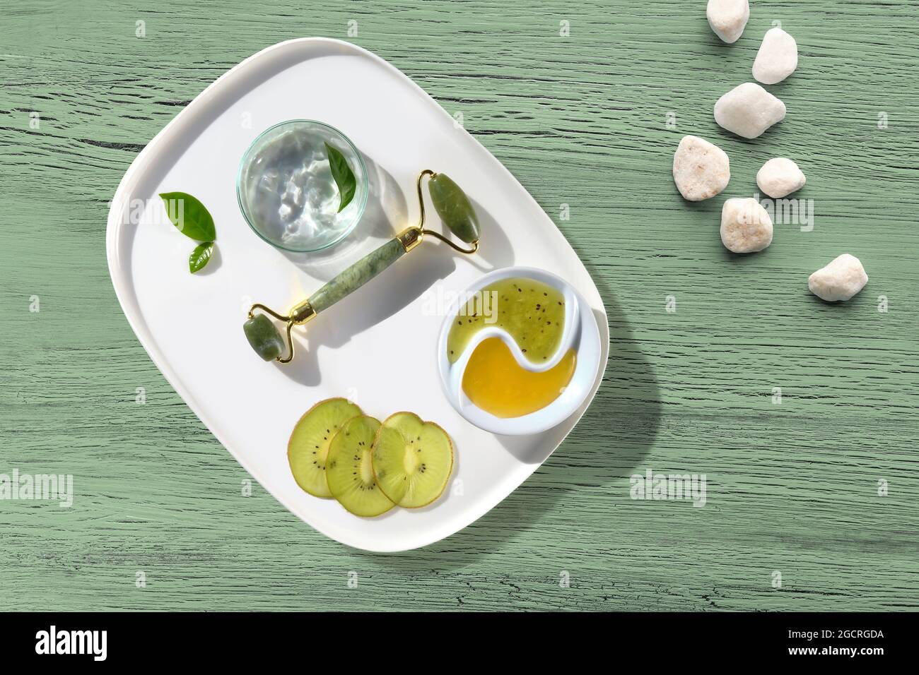 Abstract grungy blue wooden background with white stones. Copy-space ...