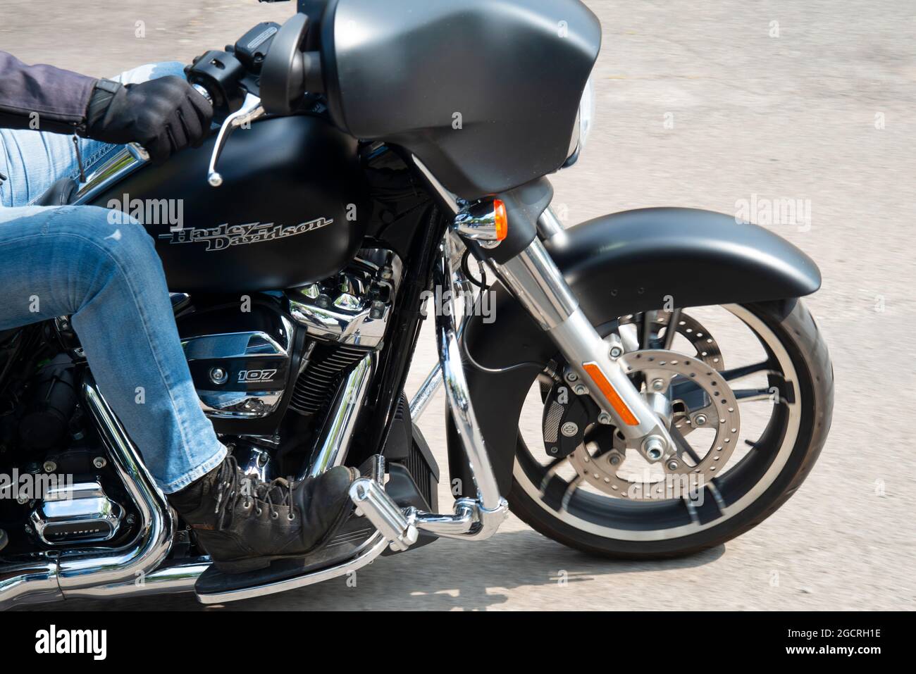 Harley Davidson Driver With His Motor Bike Stock Photo - Alamy