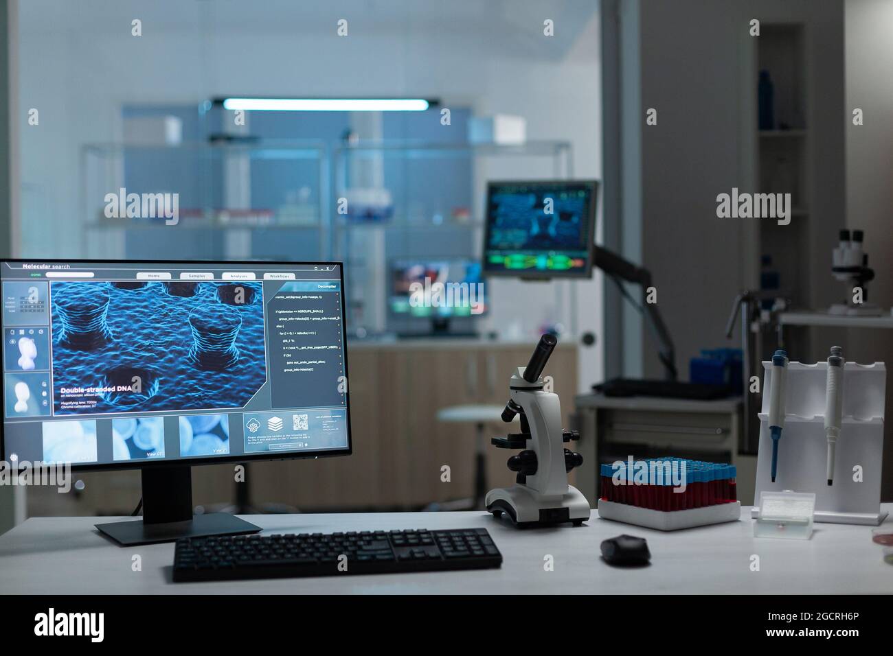 Computer with microbiology virus expertise on display standing on table ...