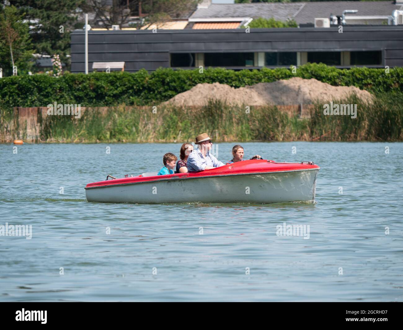 Berlare, Belgium, 22 July 2021, Man in a hat sails with his family ...