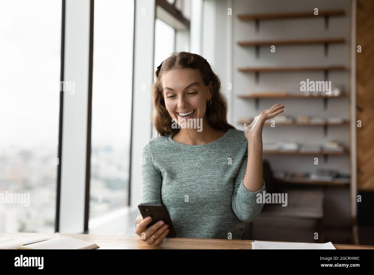 Happy overjoyed mobile phone user reading message Stock Photo - Alamy