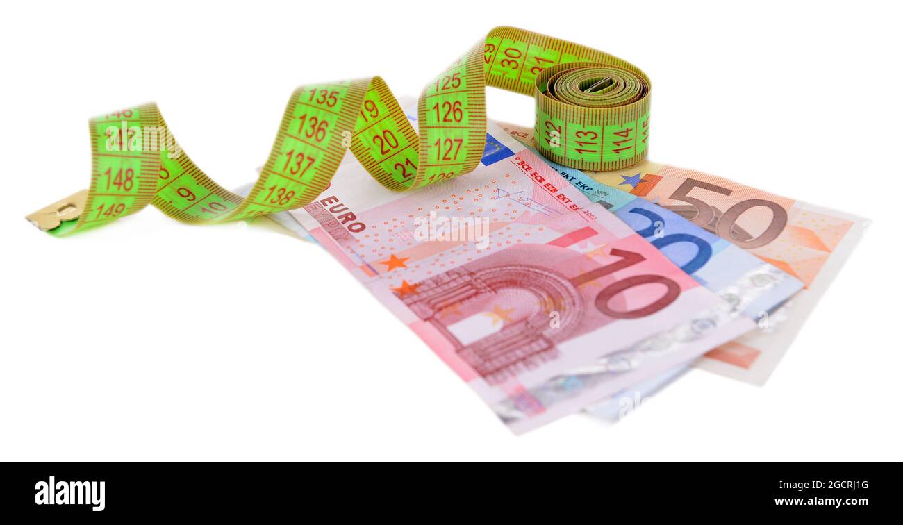 Tape measure with money isolated on white Stock Photo - Alamy