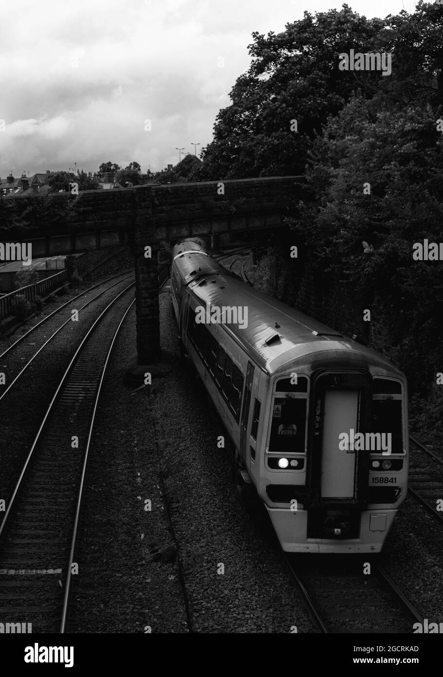 Black and white train gliding along the tracks Stock Photo - Alamy
