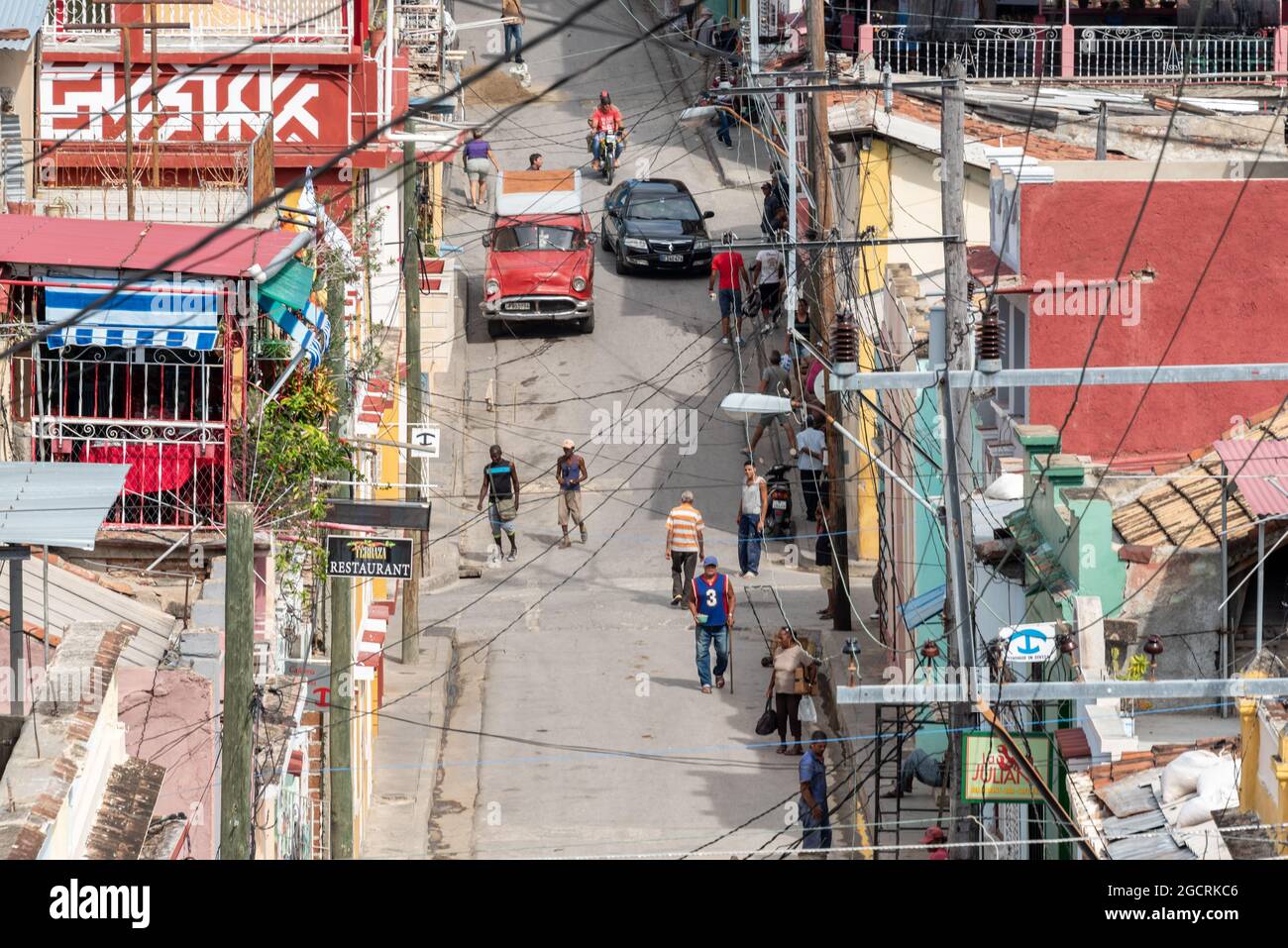 Aerial view of Cuban people in a community city street, Santiago de ...