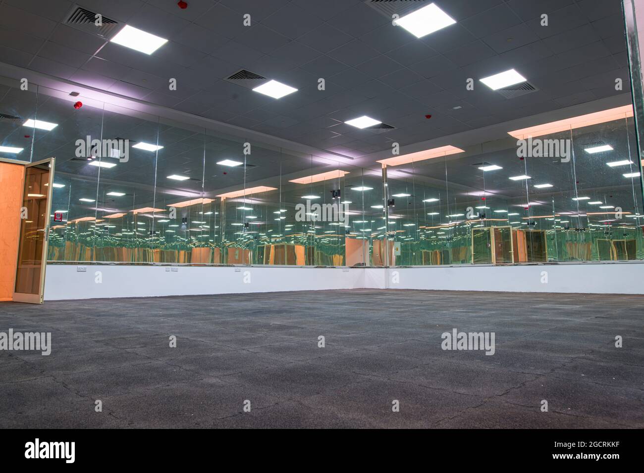 Interior photography of the gym with mirrors on the wall Stock Photo ...
